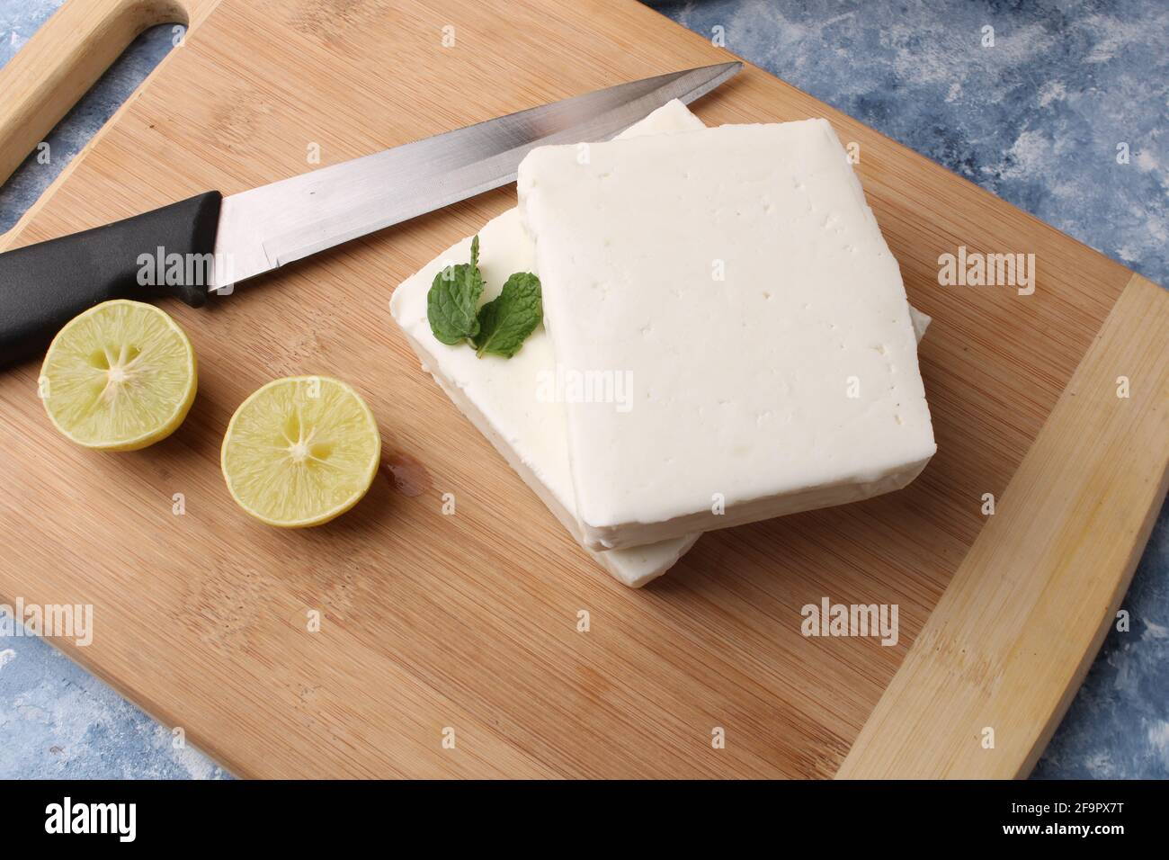 paneer making recipe ingredients, milk and lemon with fresh cottage ...
