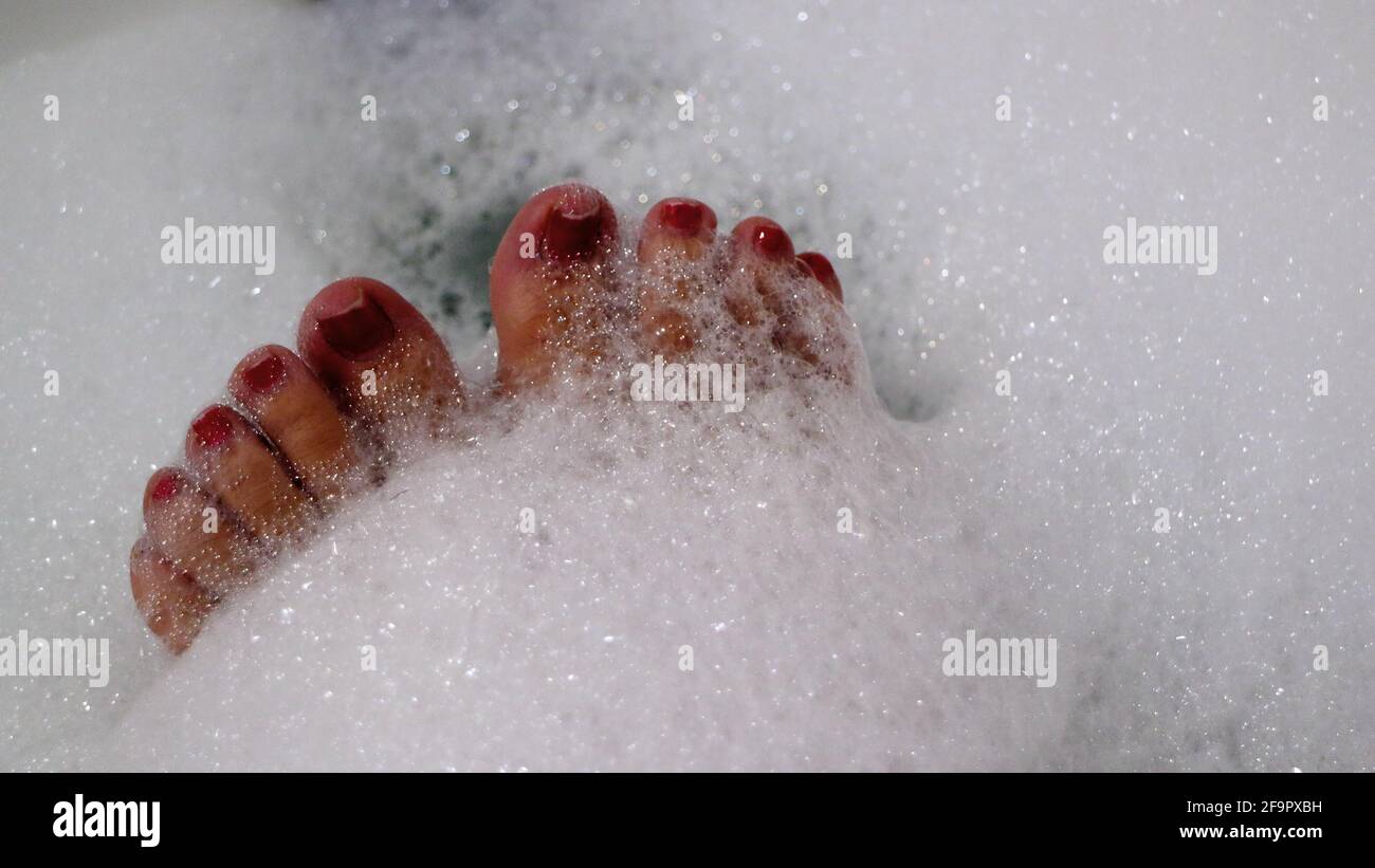 Woman in bathtub covered soap hi-res stock photography and images - Alamy