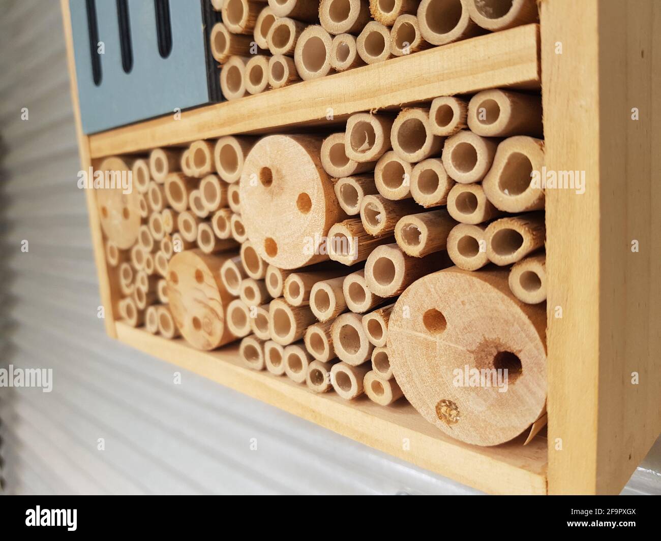 Closeup shot of a creative wooden bee home - for background and texture ...