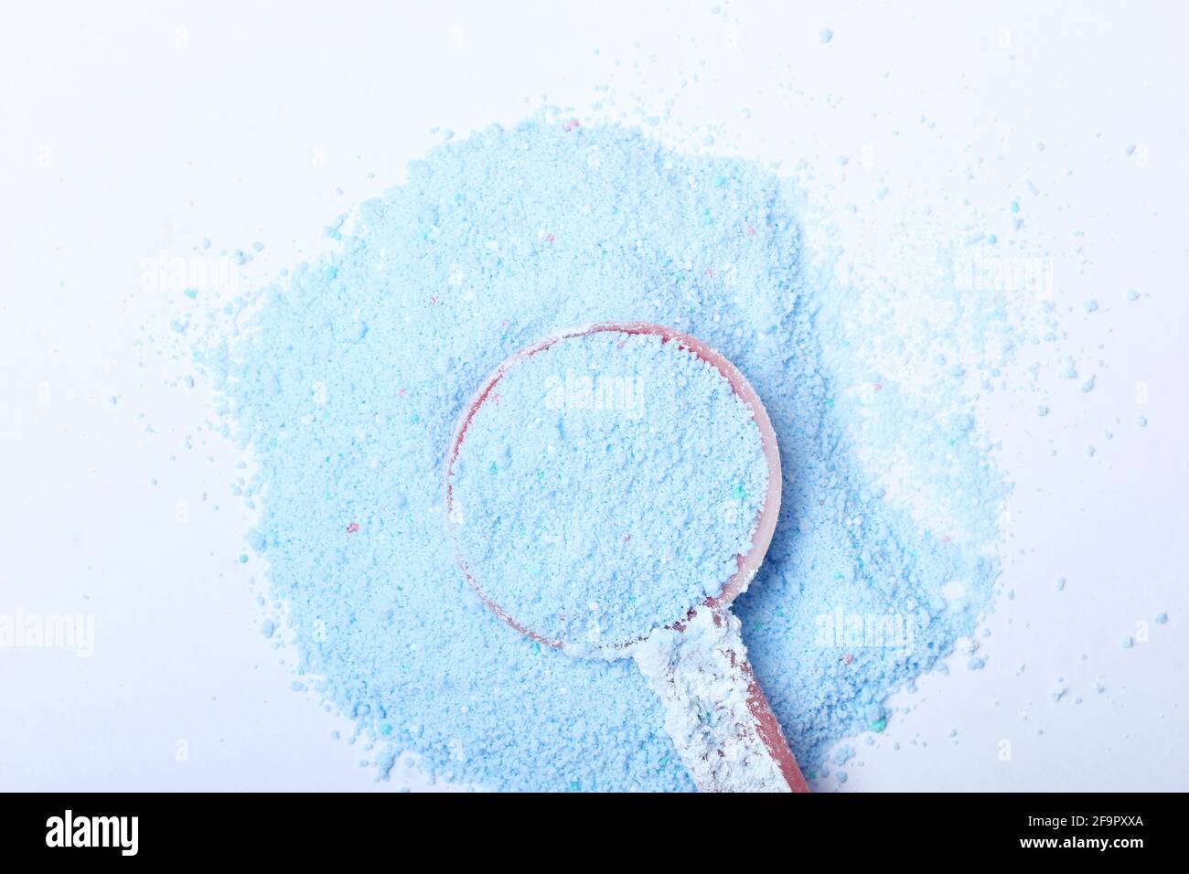 Washing powder pile isolated on white background Stock Photo - Alamy