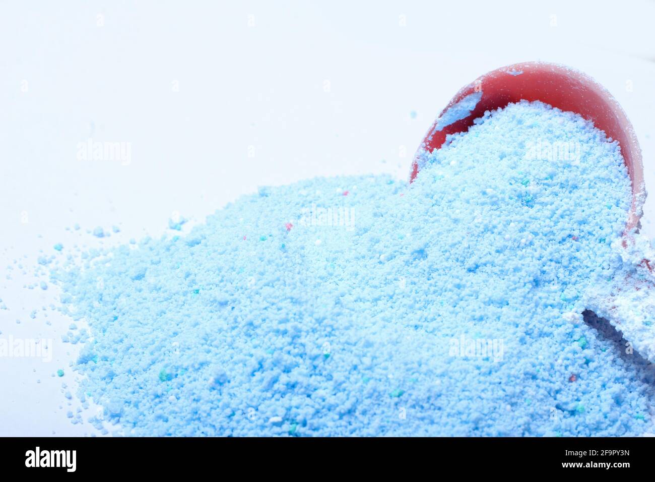 Washing powder pile isolated on white background Stock Photo - Alamy
