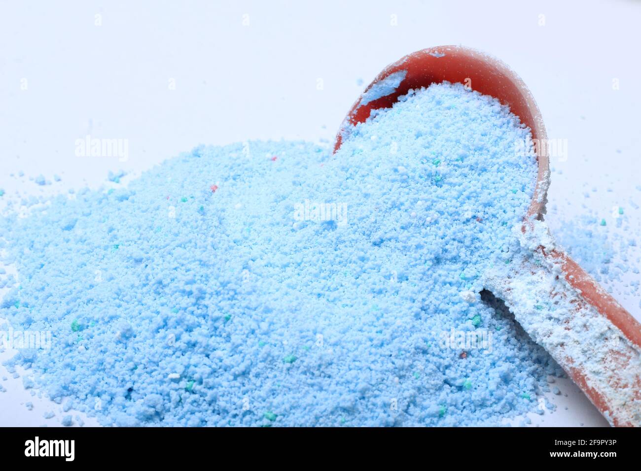 Washing powder pile isolated on white background Stock Photo - Alamy