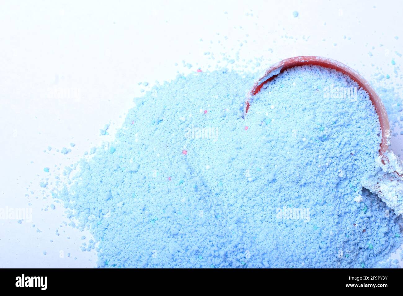 Washing powder pile isolated on white background Stock Photo - Alamy