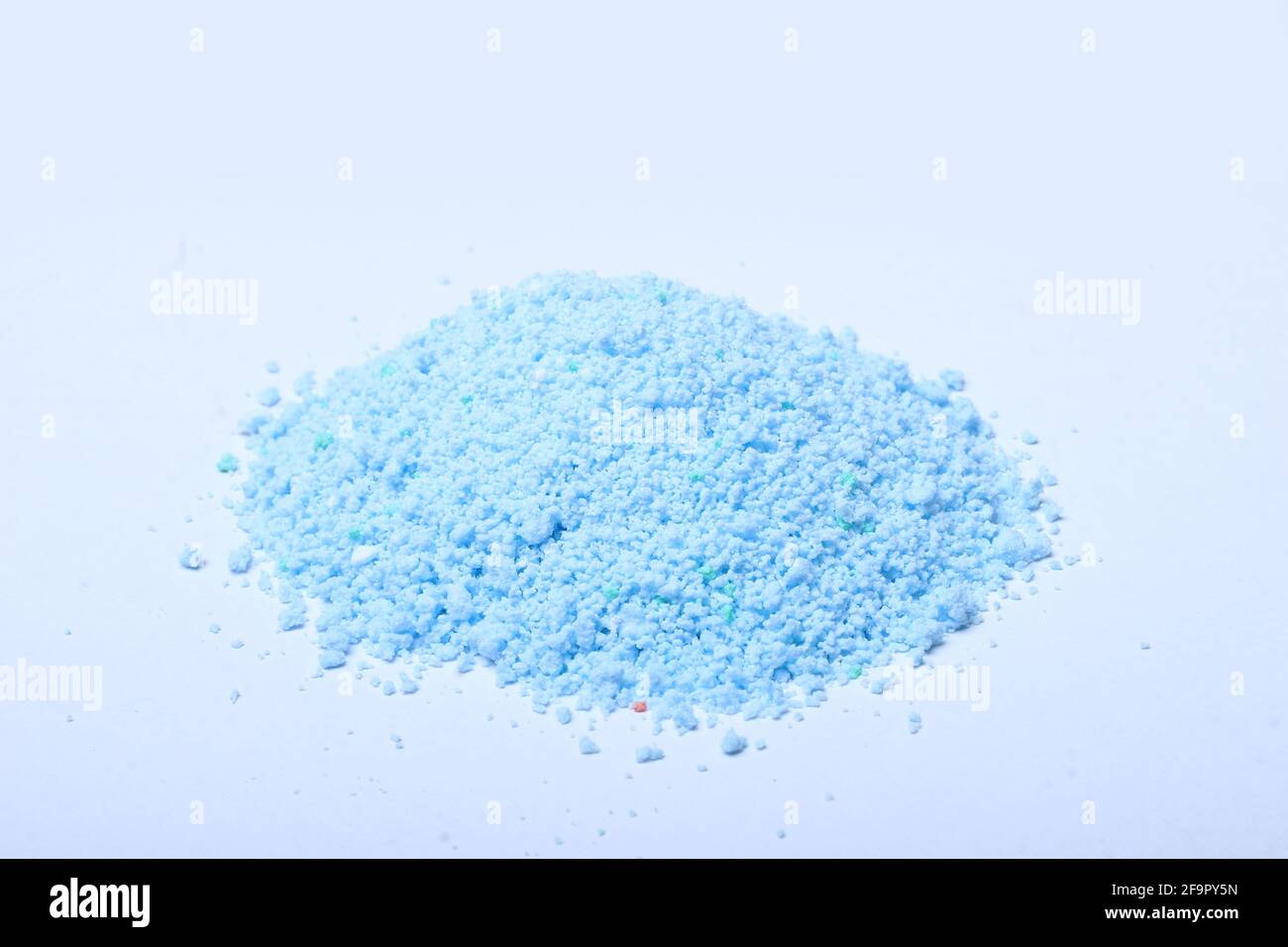Washing powder pile isolated on white background Stock Photo - Alamy