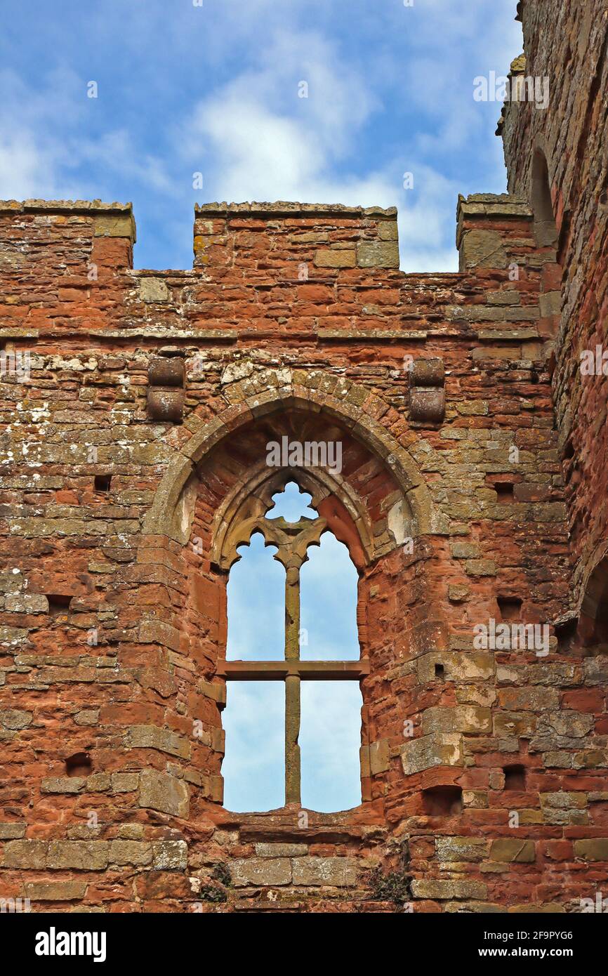 A gothic window in red stone, architectural detail of Acton Burnell ...