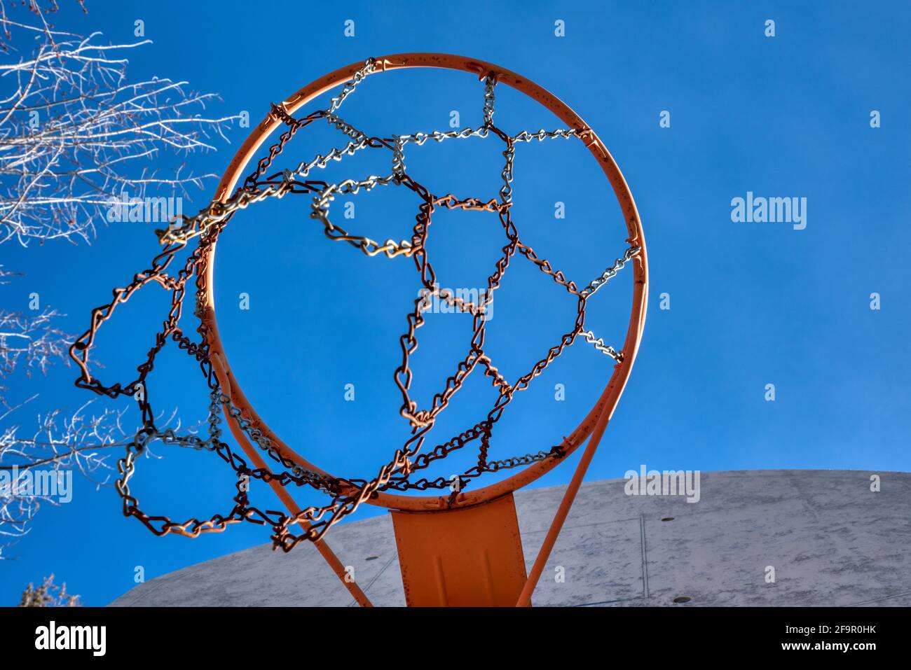 Outdoor basketball hoop with blue sky Stock Photo - Alamy