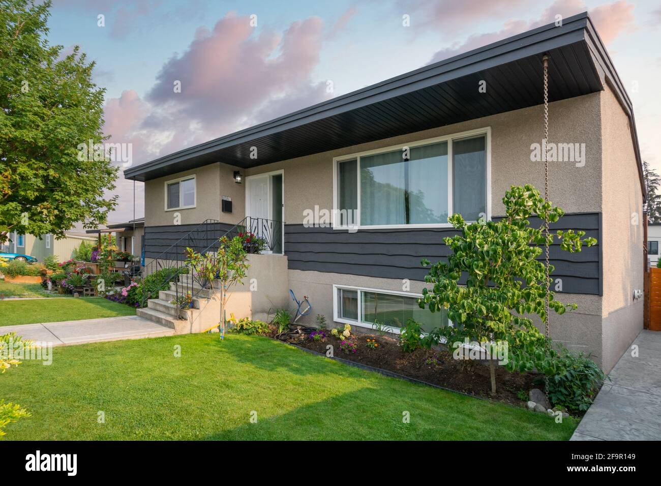 Average family house with concrete pathway over front yard Stock Photo ...