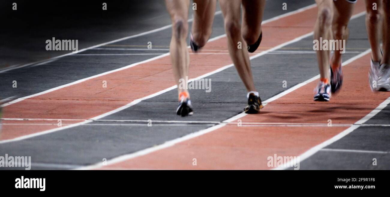 Running a race on a track for sports competition and winning Stock ...