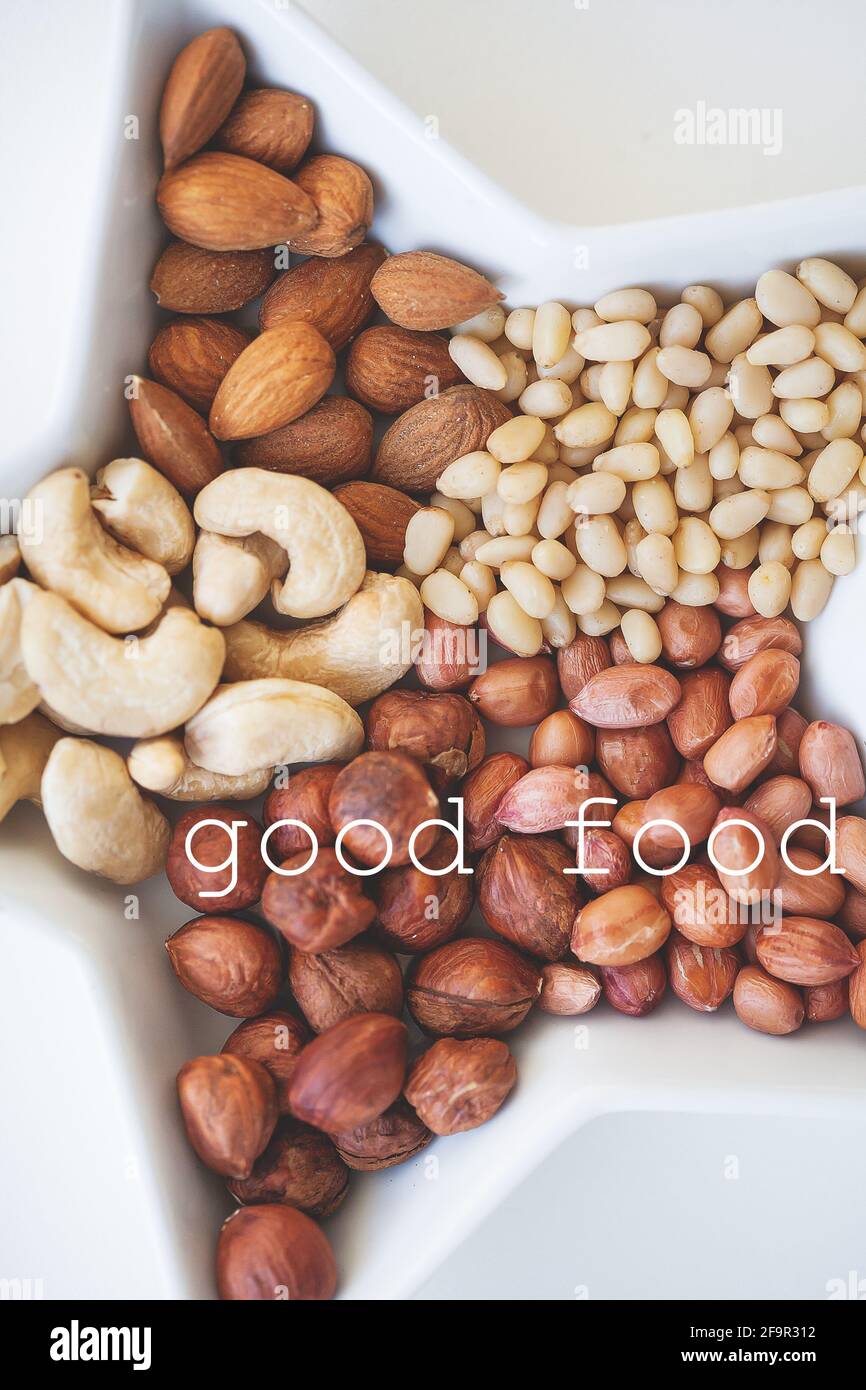 Mixed nuts in a dish in the form of stars, good food label Stock Photo ...