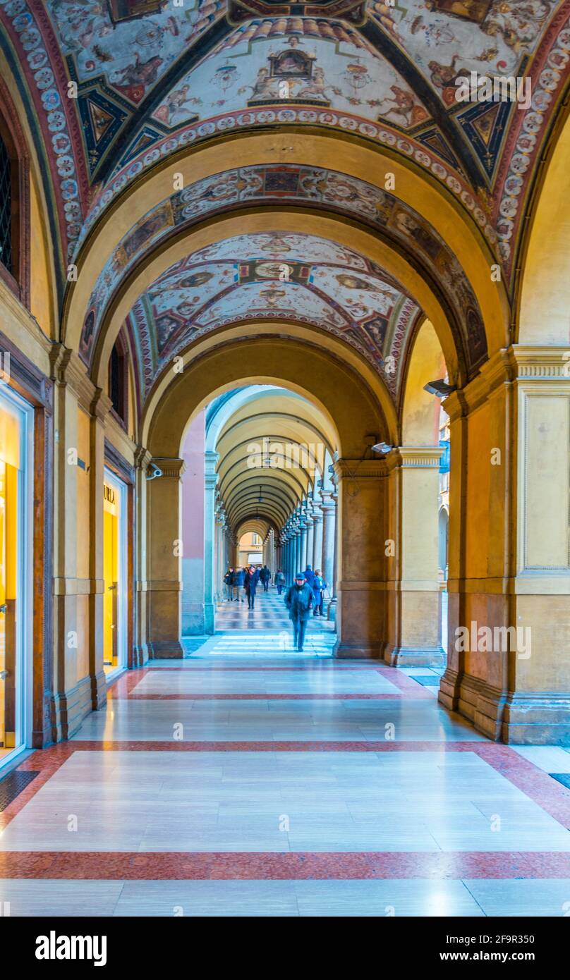 View of a covered arcade in the historical center of the italian town ...