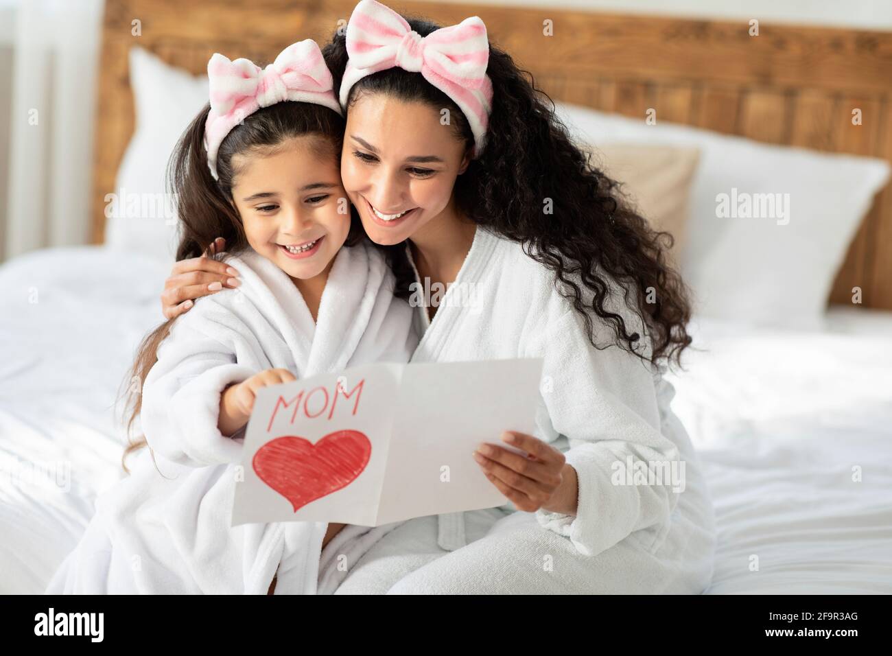 Cheerful girl resting with her beautiful mom in hotel Stock Photo - Alamy