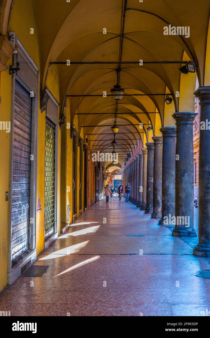 View of a covered arcade in the historical center of the italian town ...