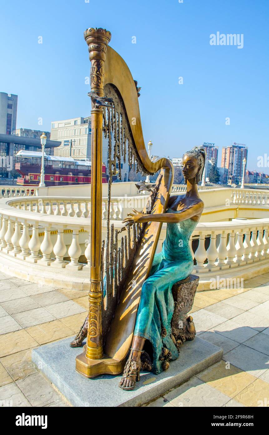 statue of female harp player situated in front of the national theatre ...