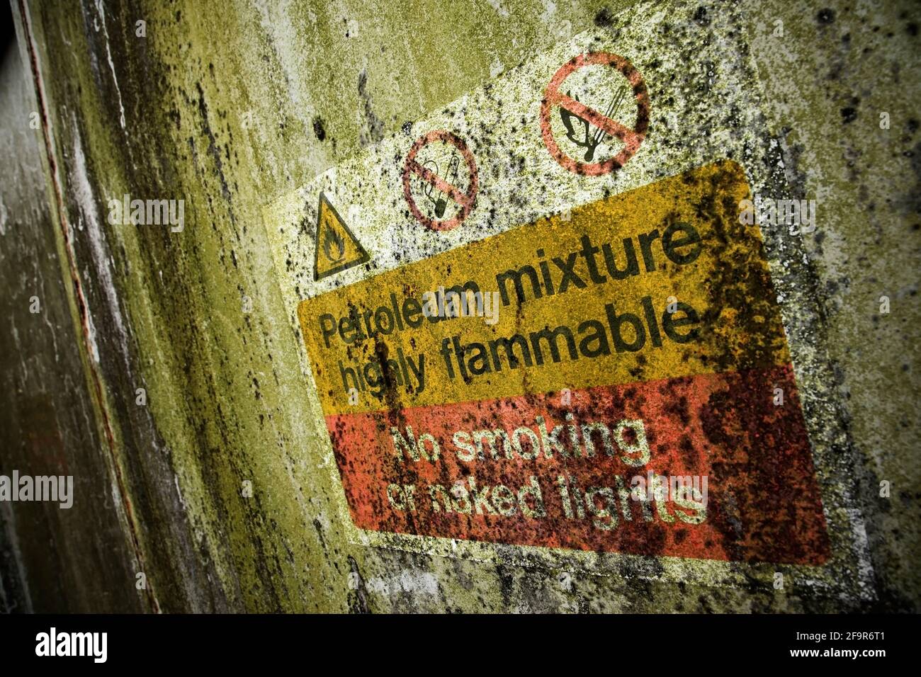 Old and dirty warning sign on storage area for petroleum products Stock ...