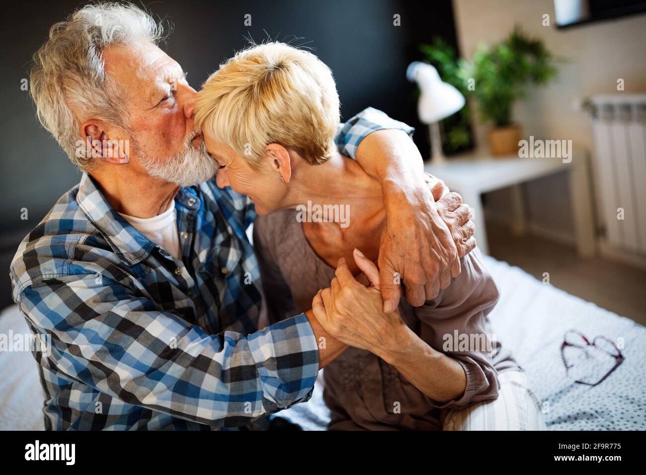 Happy Senior Couple In Love Hugging And Bonding With True Emotions At
