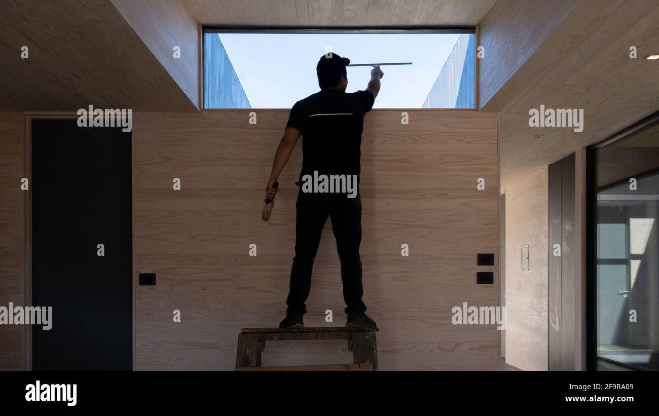 man cleaning house windows, tall window, house cleaning, house man ...