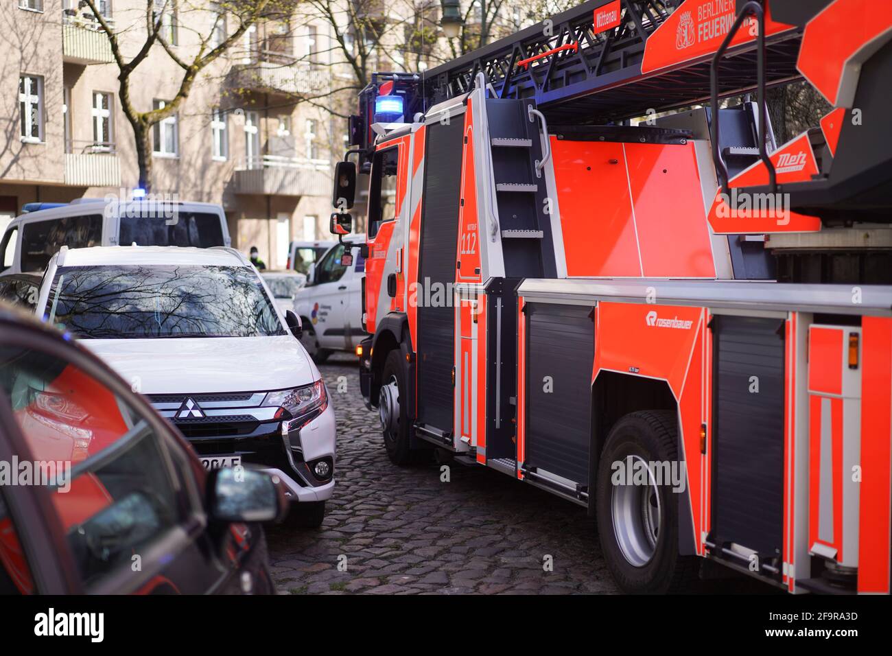 Berlin, Germany. 20th Apr, 2021. A fire brigade ladder truck drives ...