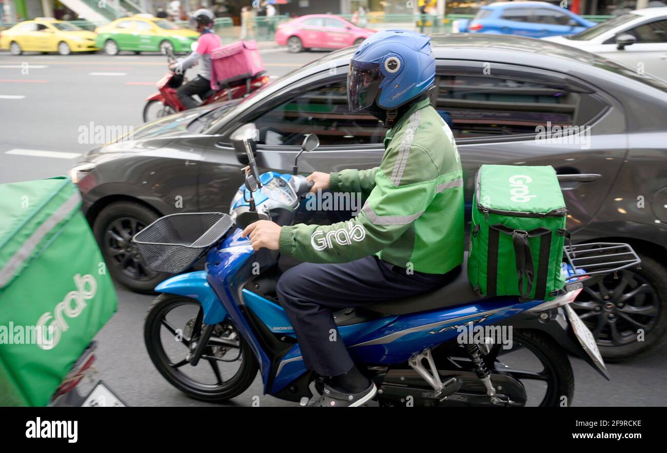 Bangkok, Thailand. 20th Apr, 2021. A Grab motorcycle rider seen making ...