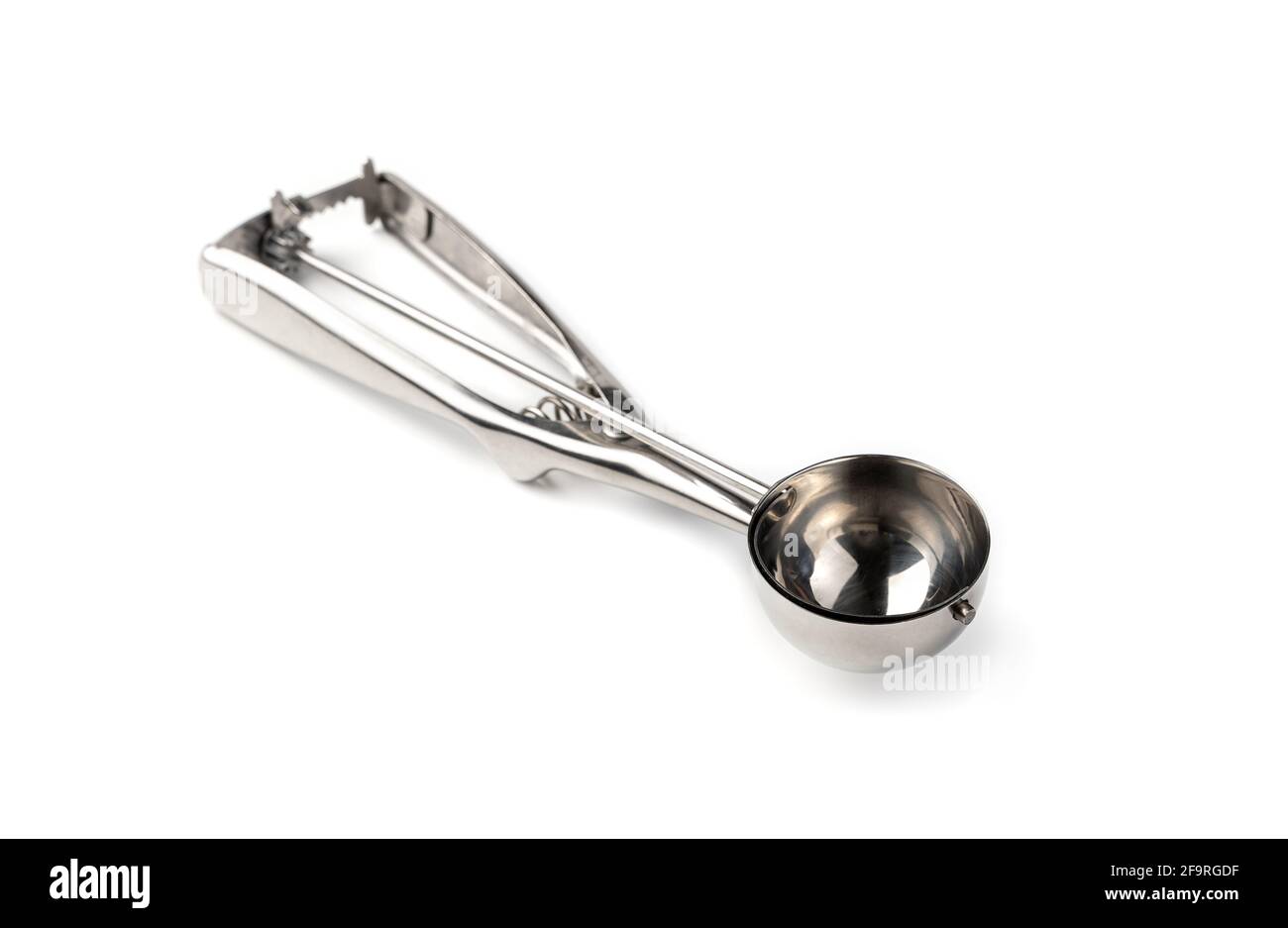 Ice cream spoon, a device for creating balls of food. Isolated on white ...