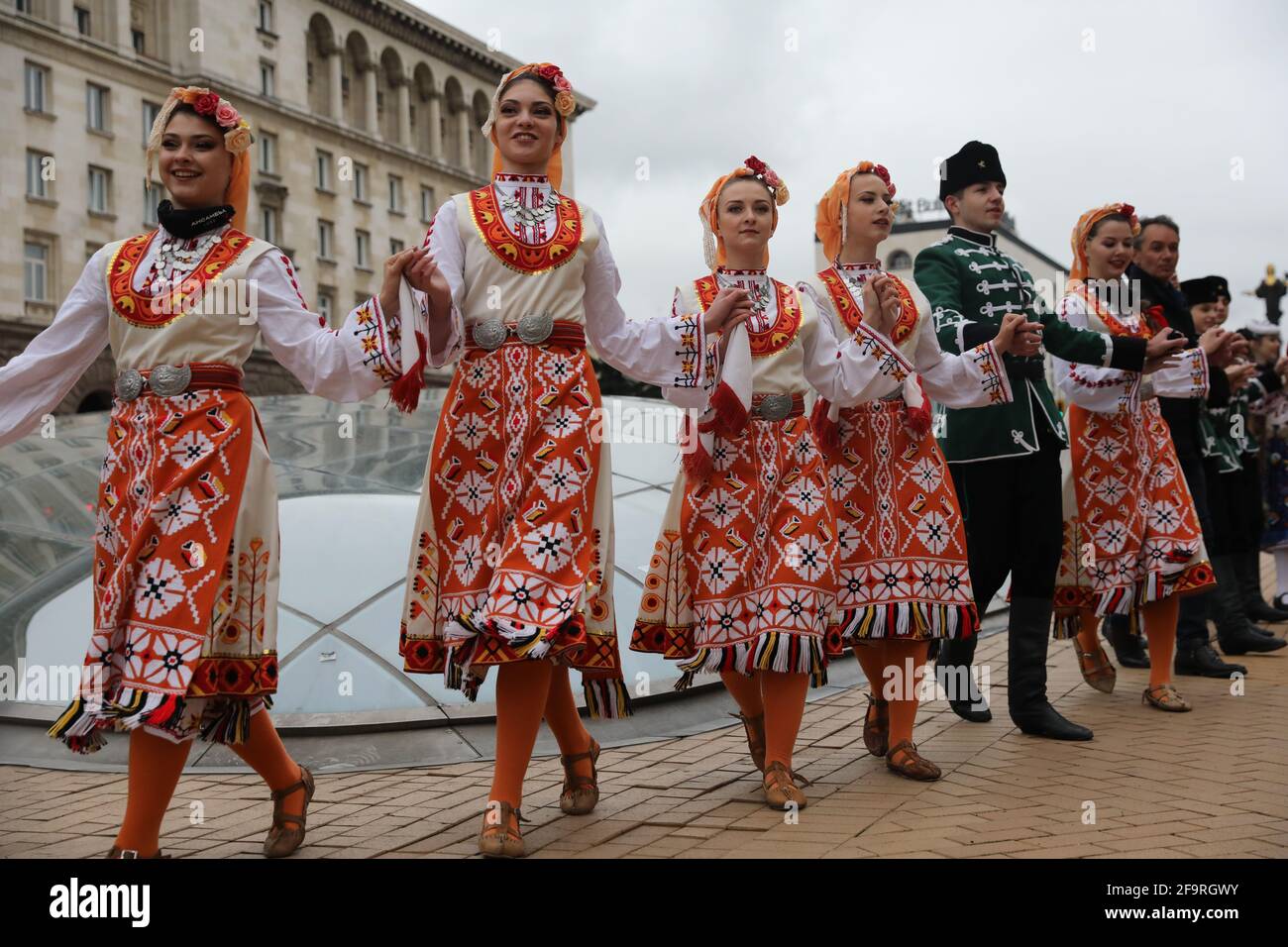 People in traditional folk costumes perform the Bulgarian folk dance ...