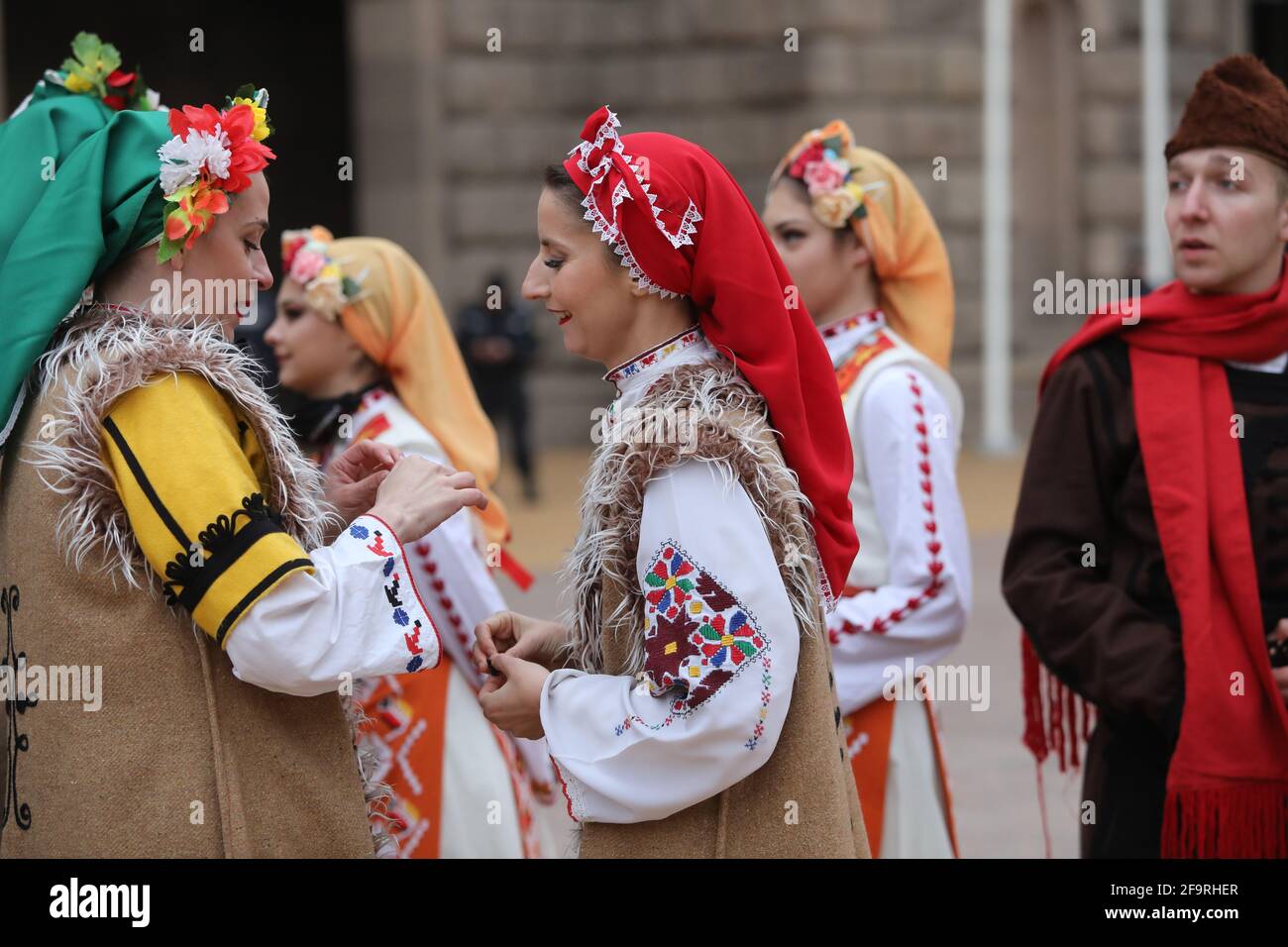 People in traditional folk costumes perform the Bulgarian folk dance ...