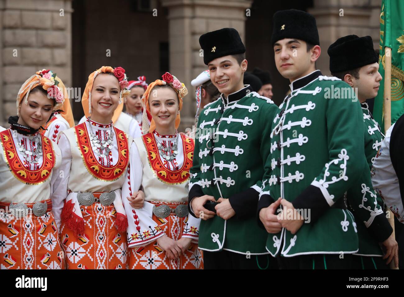 People in traditional folk costumes perform the Bulgarian folk dance ...