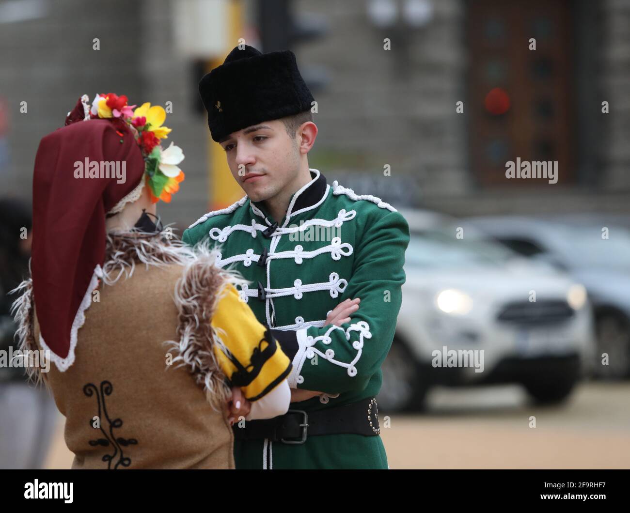 People in traditional folk costumes perform the Bulgarian folk dance ...