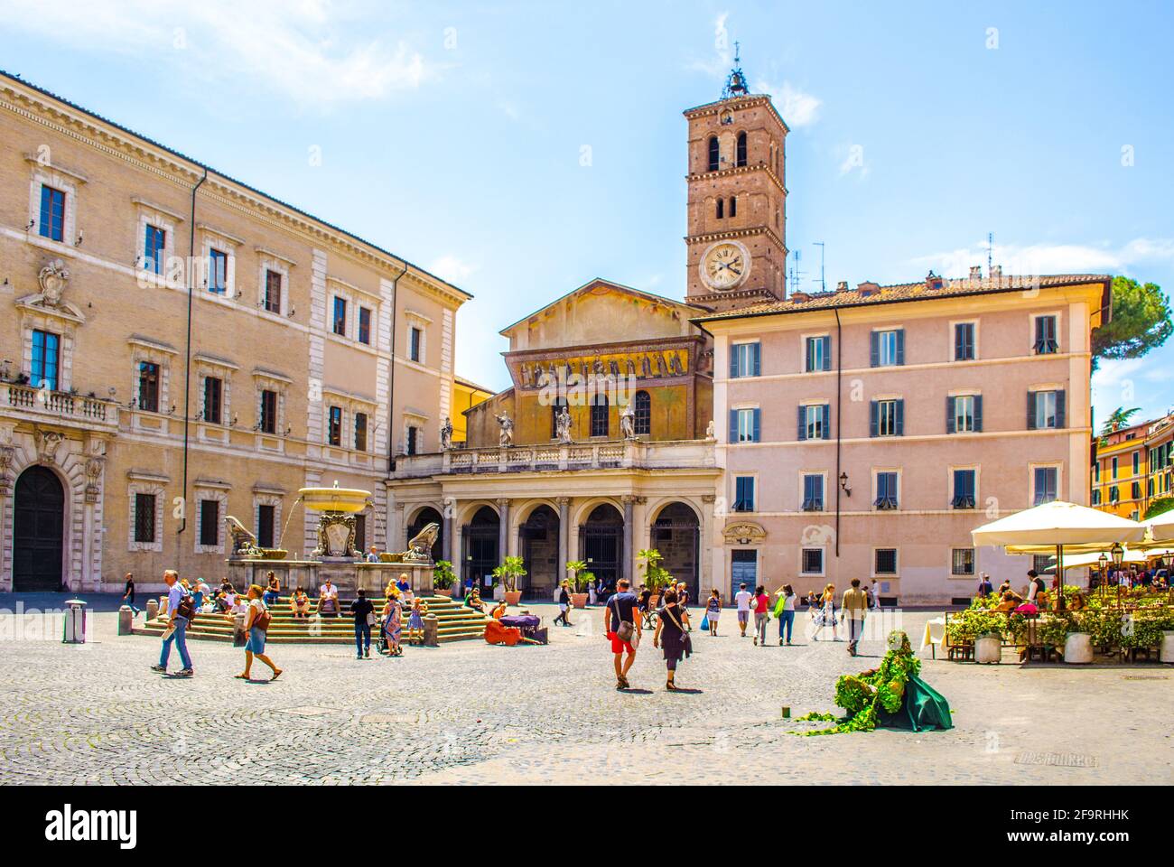 people are strolling through piazza di santa maria situated in front of ...