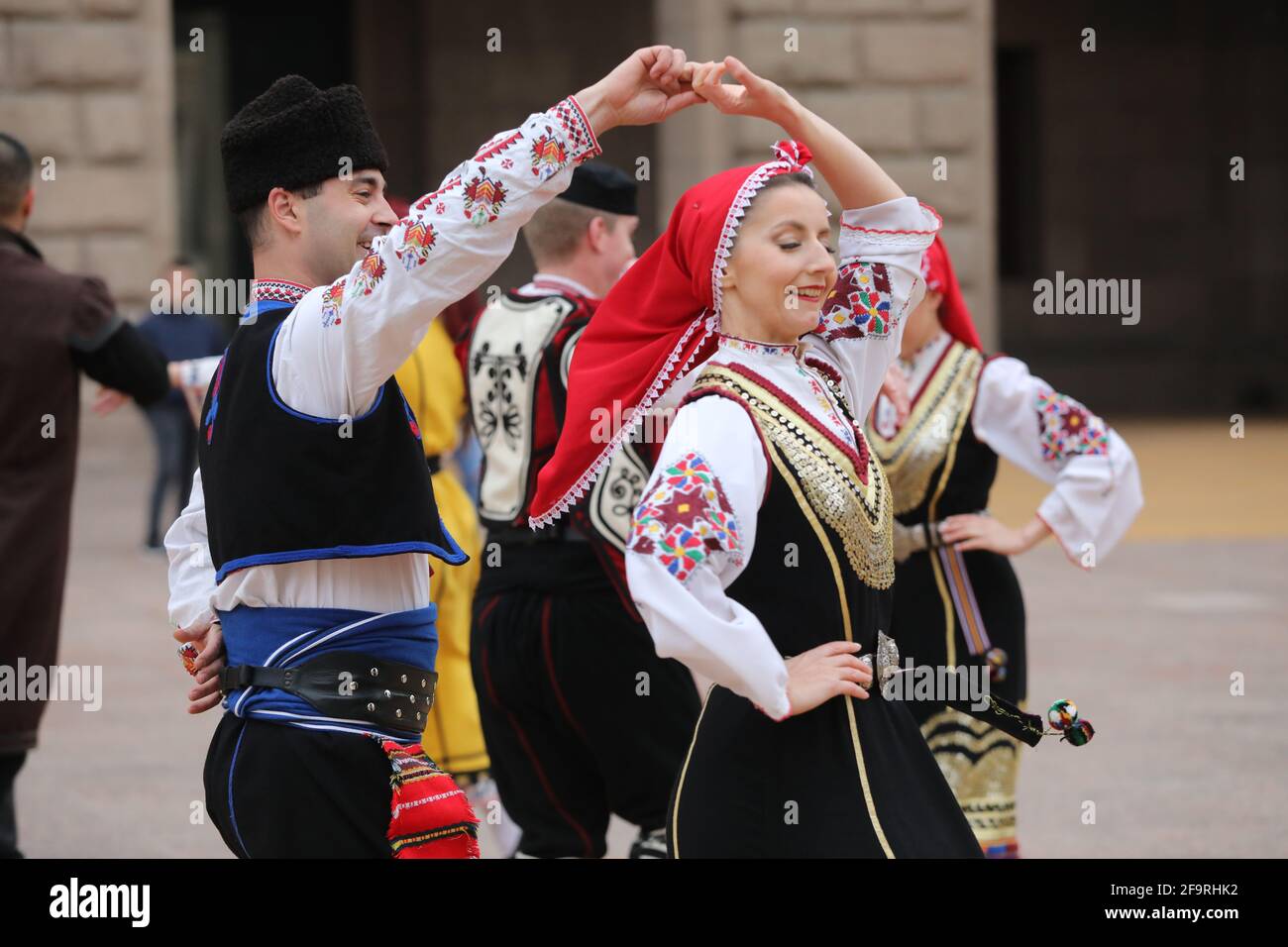 People in traditional folk costumes perform the Bulgarian folk dance ...