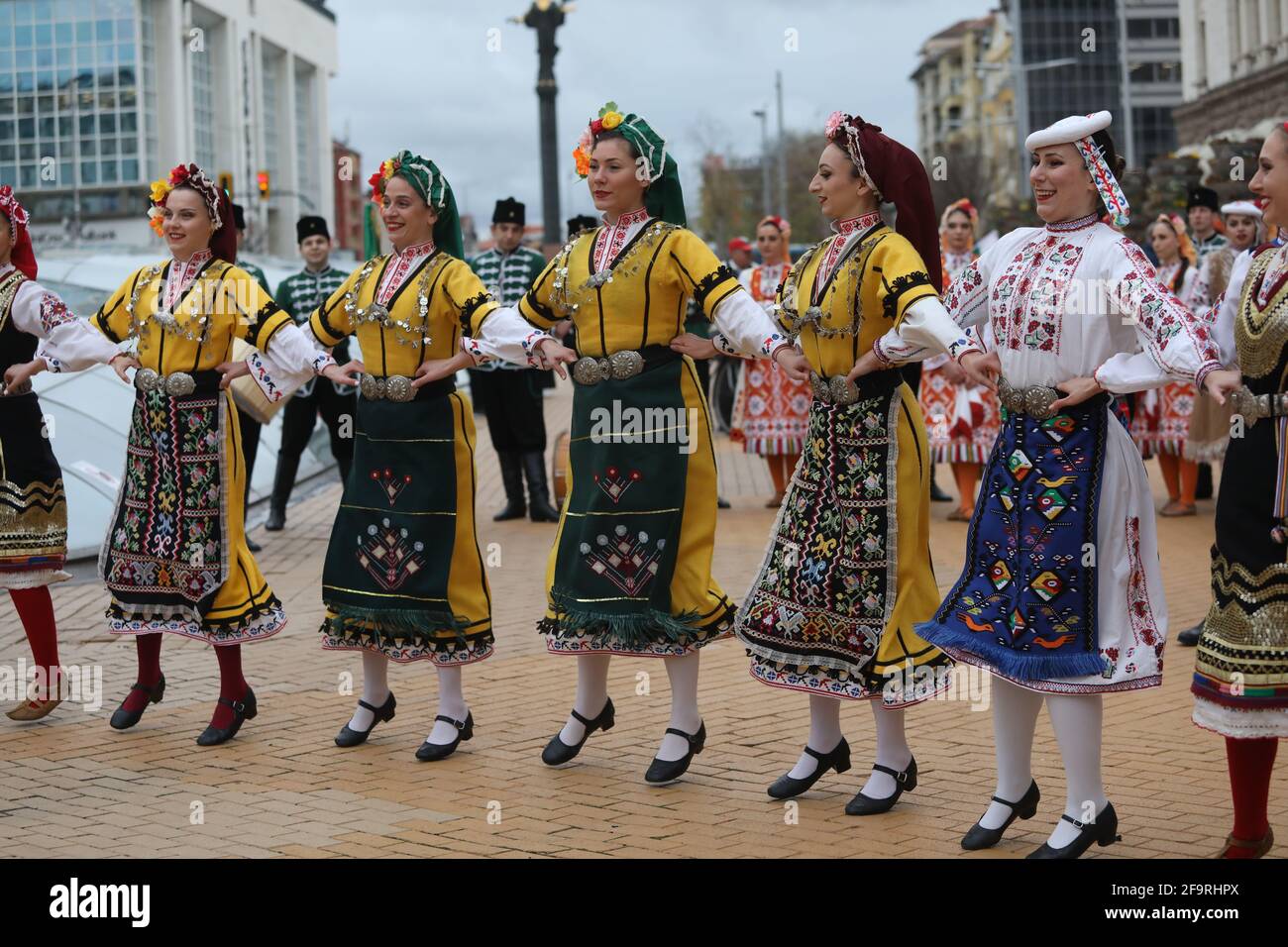 People in traditional folk costumes perform the Bulgarian folk dance ...