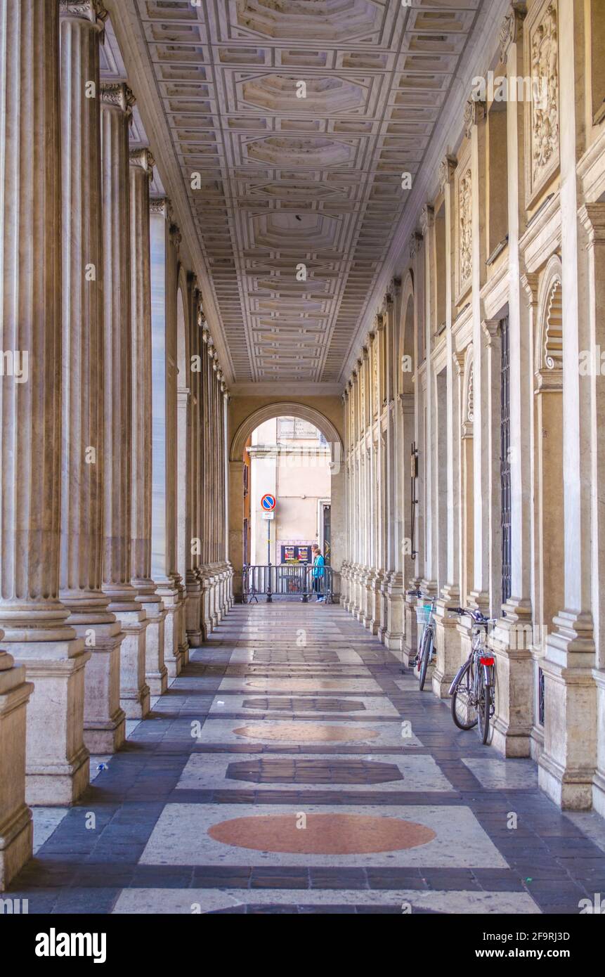 arcade with columns and reliefs on ceiling in city center of rome Stock ...