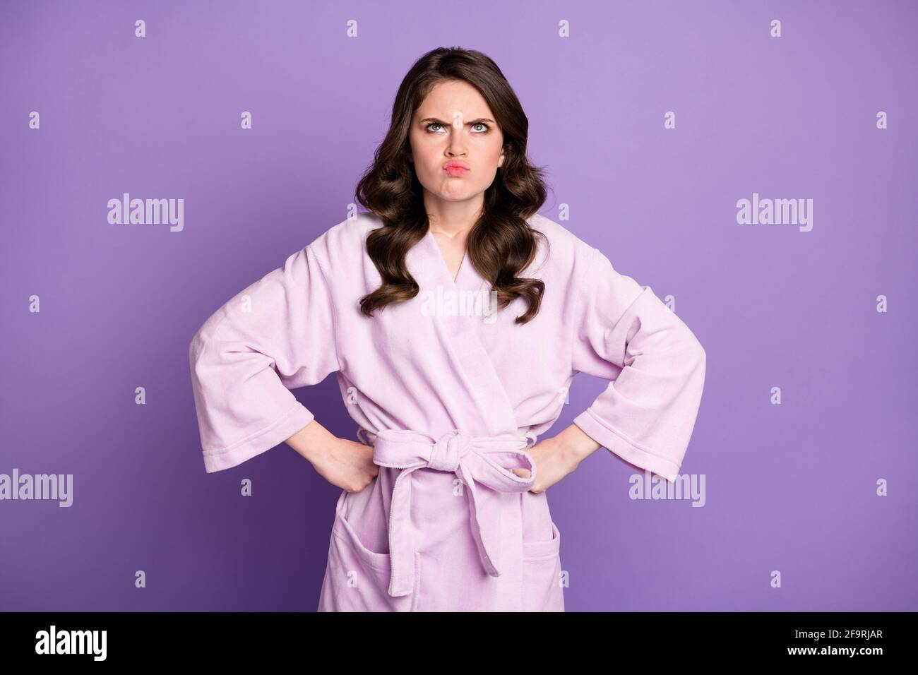 Photo of angry beautiful cute girl look copyspace hold hands waist ...