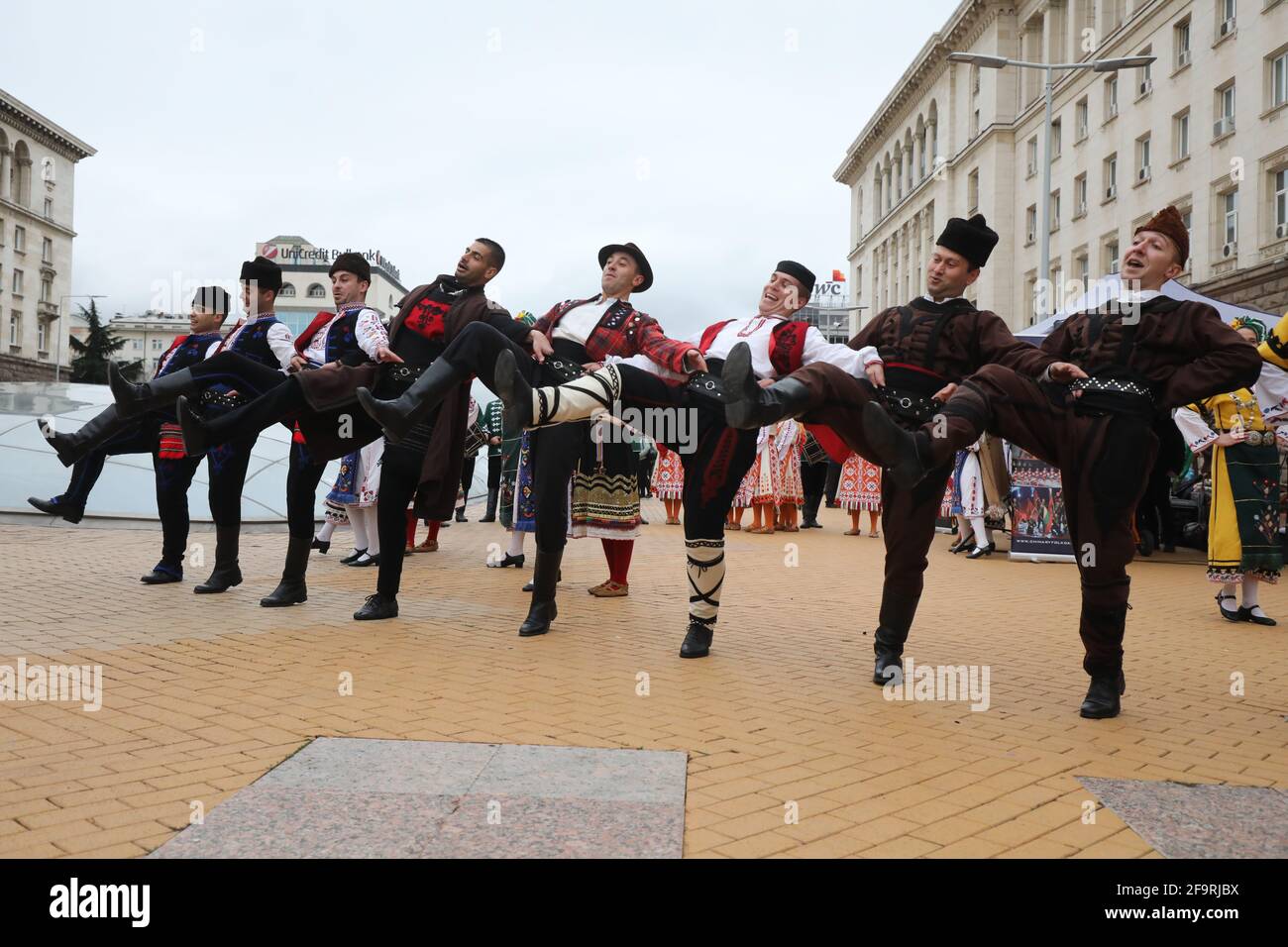 People in traditional folk costumes perform the Bulgarian folk dance ...