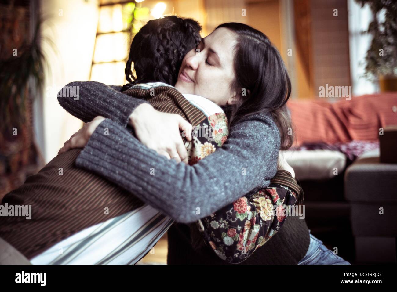 Female friends hug hi-res stock photography and images - Alamy