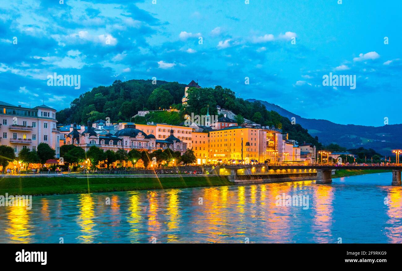 Riverside of the Salzach river in Salzburg during sunset, Austria Stock ...