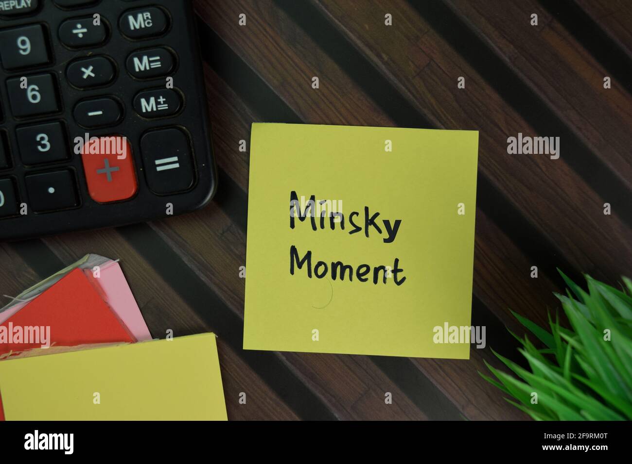Minsky Moment write on sticky notes isolated on Wooden Table Stock ...