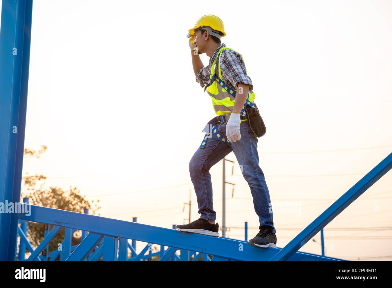 Safety harness and helmet and worker hi-res stock photography and ...