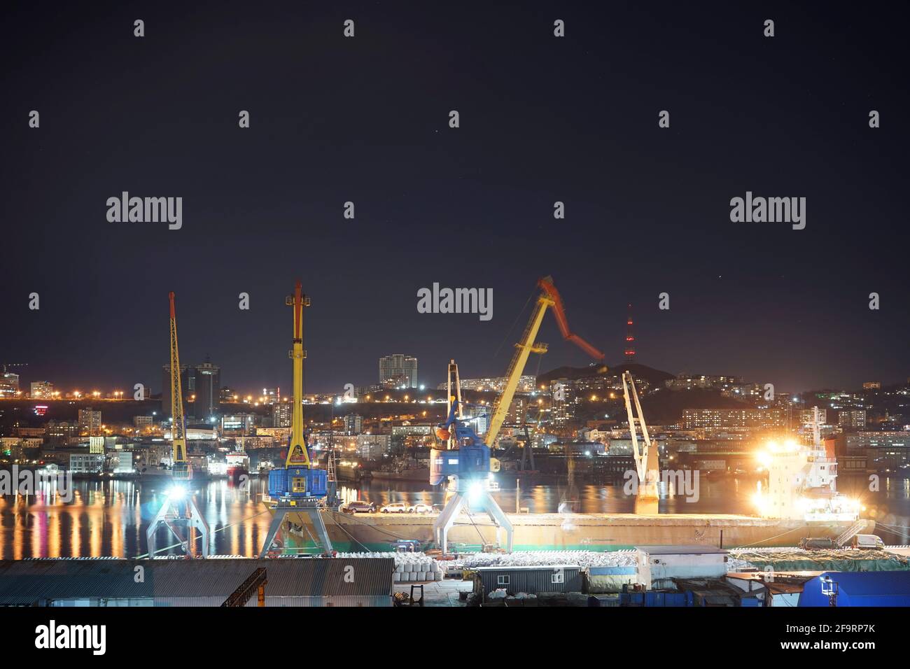 Night landscape with port view on city background Stock Photo - Alamy