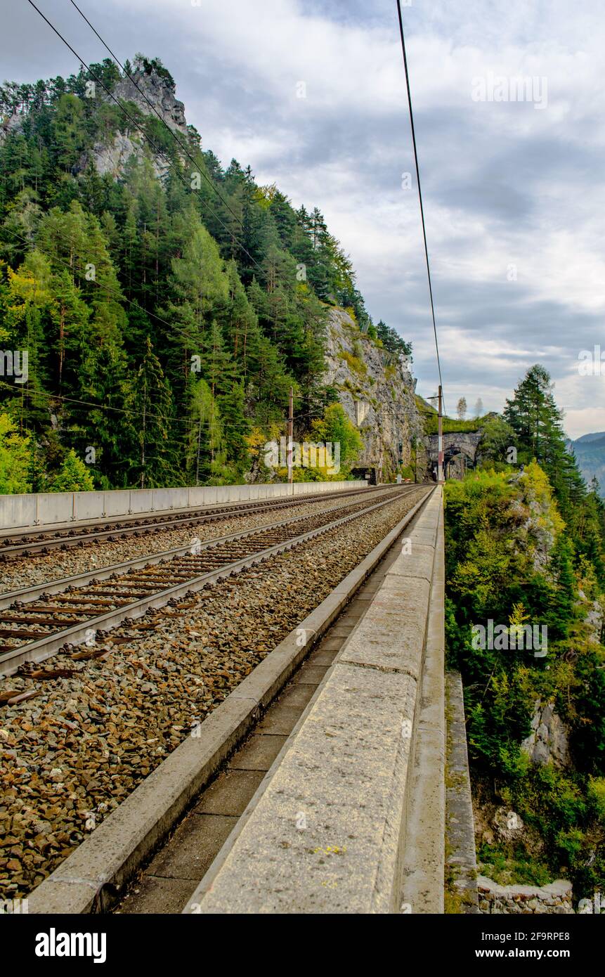 view of a railroad bridge of the semmeringbahn railway in austria which ...