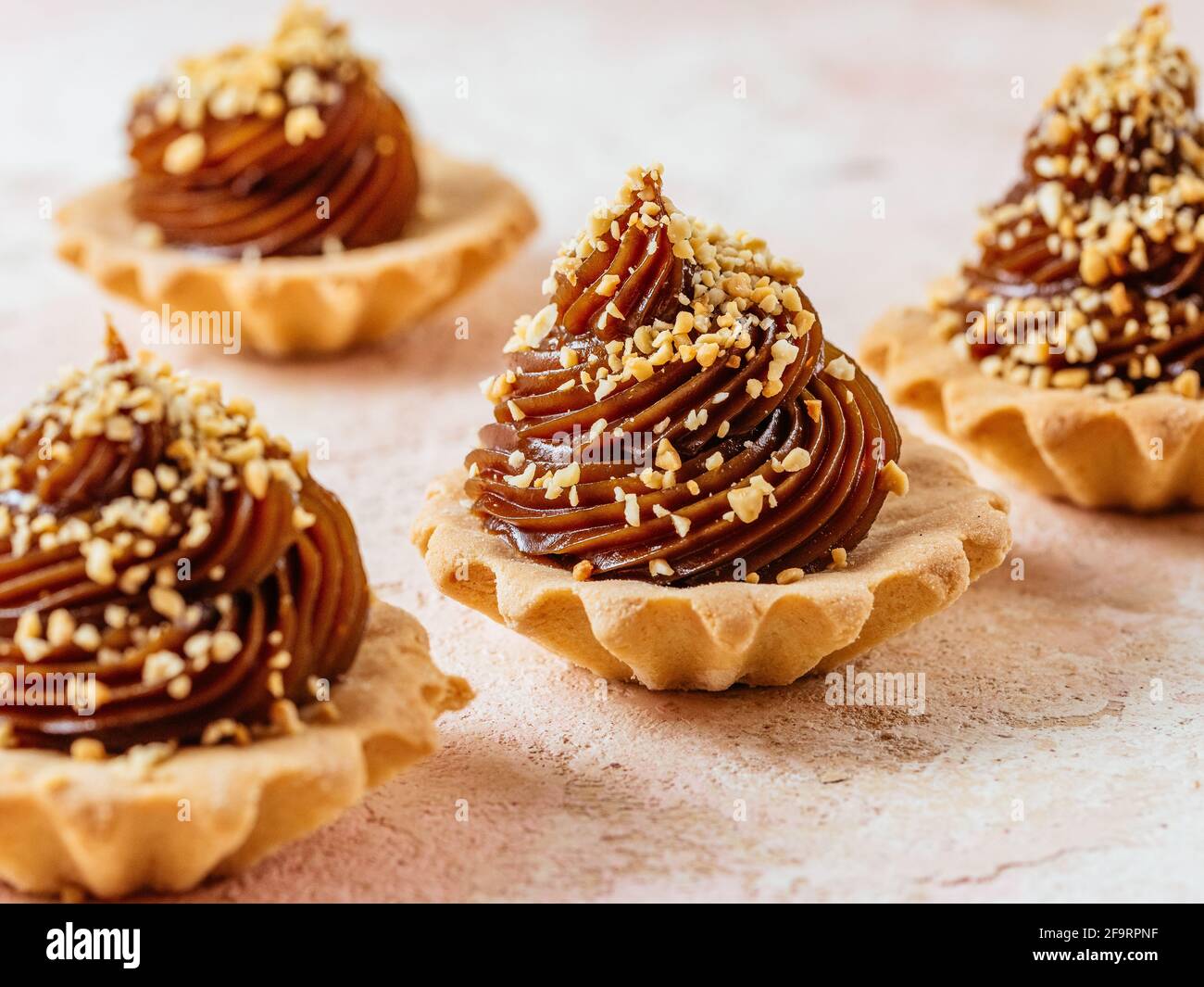 homemade desserts with caramel, nuts on a light background Stock Photo ...