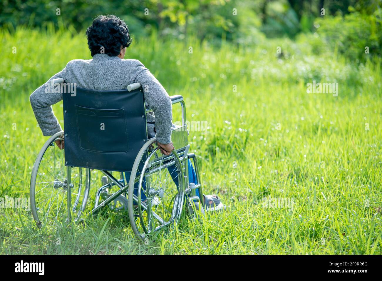 Elderly woman using wheelchair,Asia old woman sitting Stock Photo - Alamy