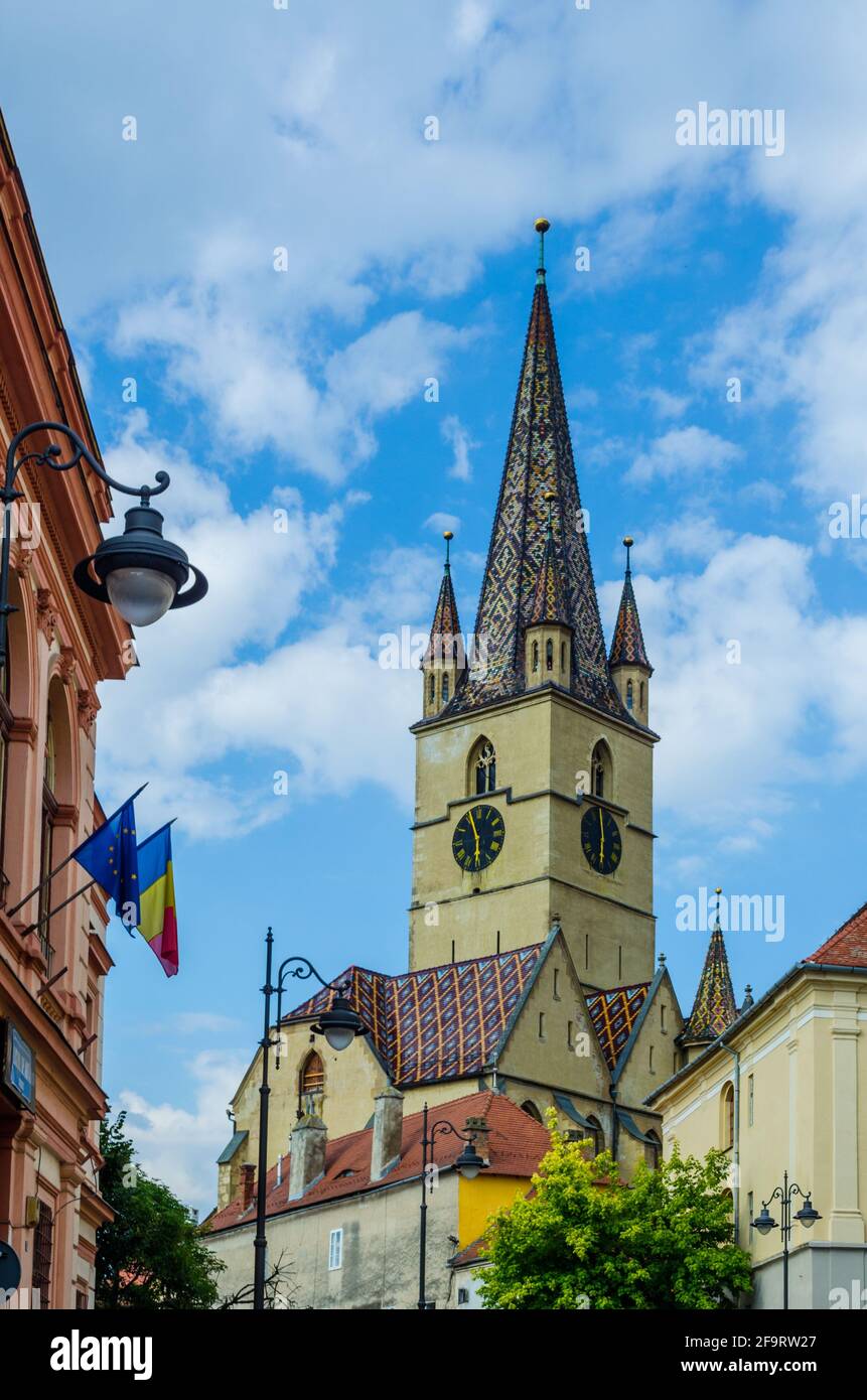 The 73.34 m high steeple with clock and four turrets of the Evangelic ...