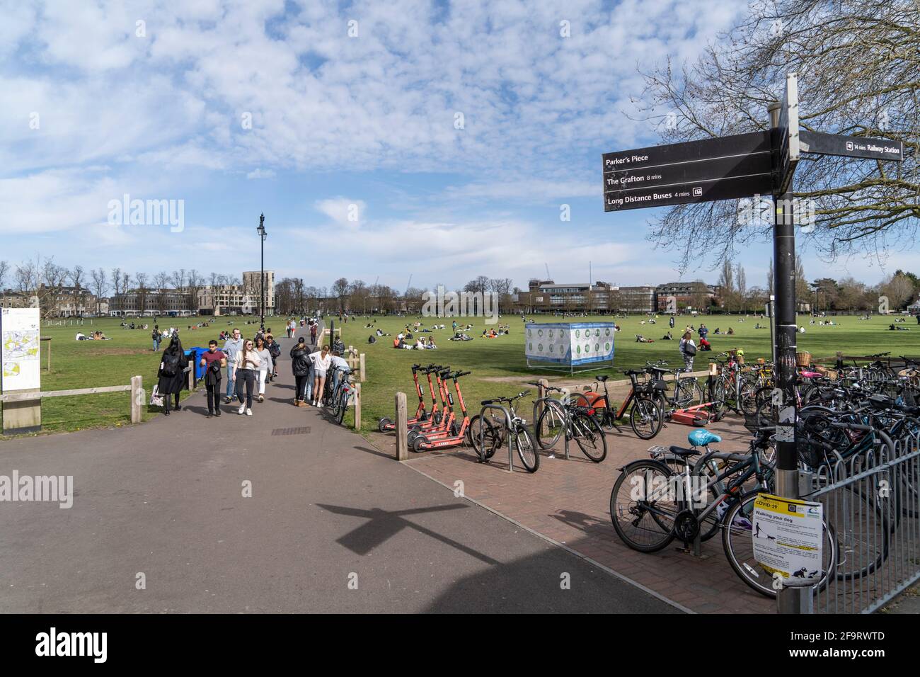 People walk across the Parkers Piece in Cambridge city center. (Photo ...