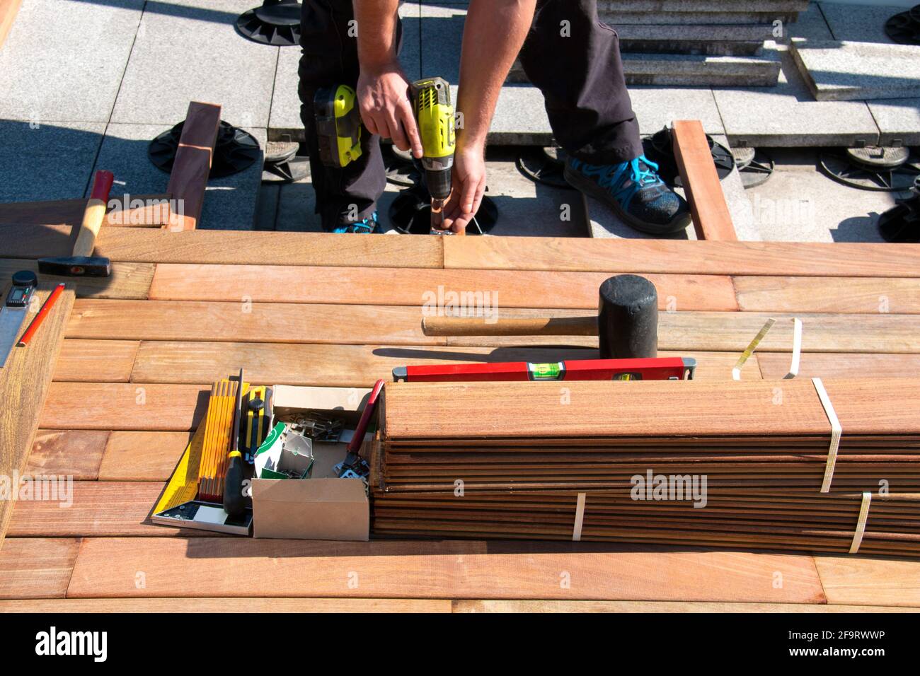 Carpenter building wooden deck construction, Ipe wood deck installation ...