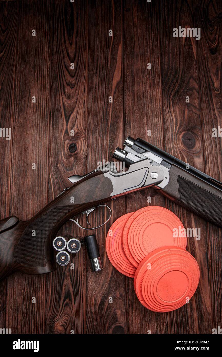 Clay target plates for shooting with rifle on wooden background Stock ...