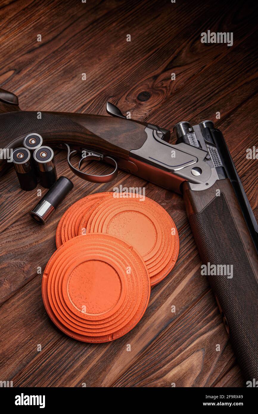 Clay target plates for shooting with rifle on wooden background Stock ...