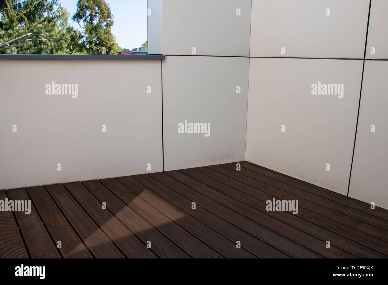 Pine wood deck on balcony, treated softwood decking terrace contrasting ...
