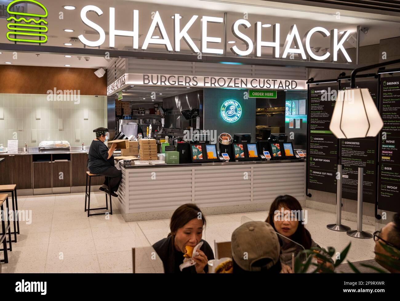Customers seen eating at the American fast casual restaurant chain Shake Shack in Hong Kong ...
