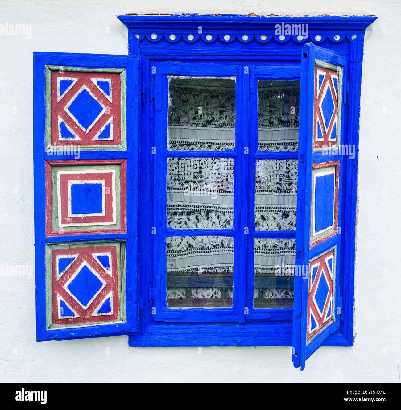 Traditional wooden blue window against white wall Stock Photo - Alamy