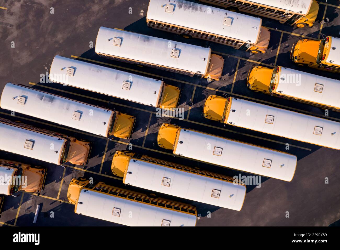 Aerial overhead photo of a parking lot full with school busses Stock ...